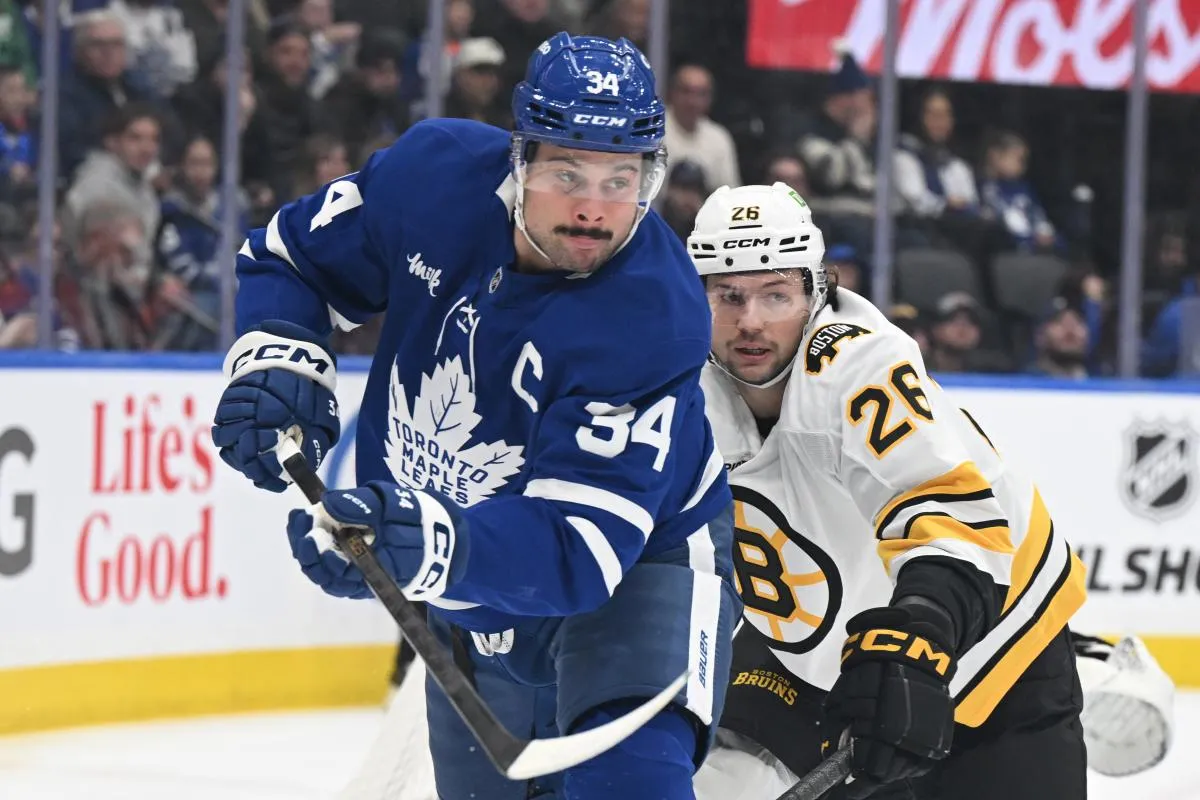 Auston Matthews leaves the game after taking a hit from Nikita Zadorov